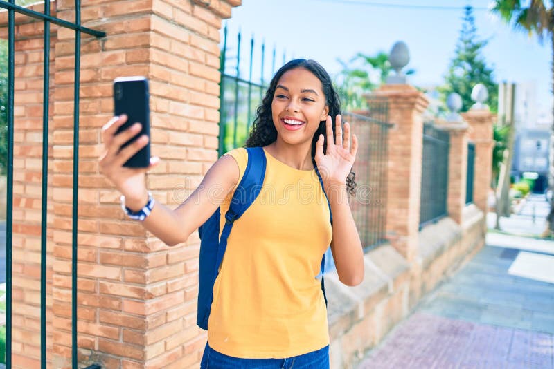 Young African American Student Girl Doing Video Call Using Smartphone ...