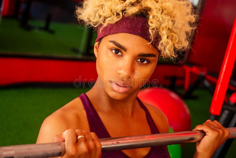 Young African American Woman Activity Working Out In Gym Indoor Stock