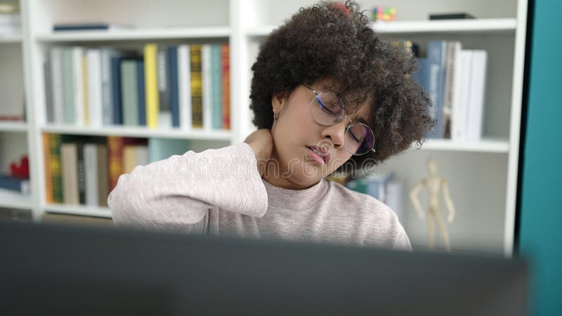 Young African American Woman Student Using Computer Stressed at ...