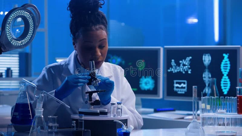 A Young African American Woman Types on a Computer Keyboard and Then ...