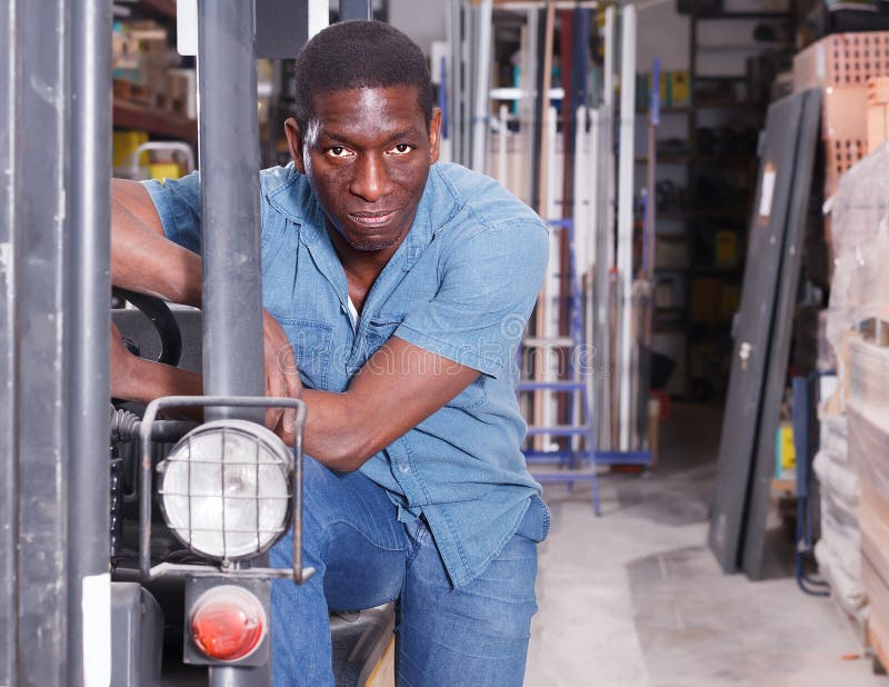 Young Worker on Forklift in Building Store Stock Image - Image of ...
