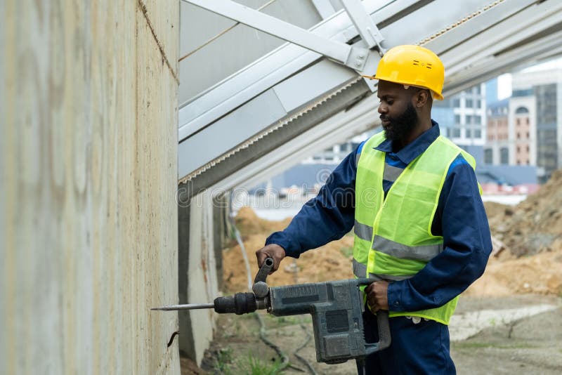 Young African Builder Using Huge Drill Stock Image - Image of ...