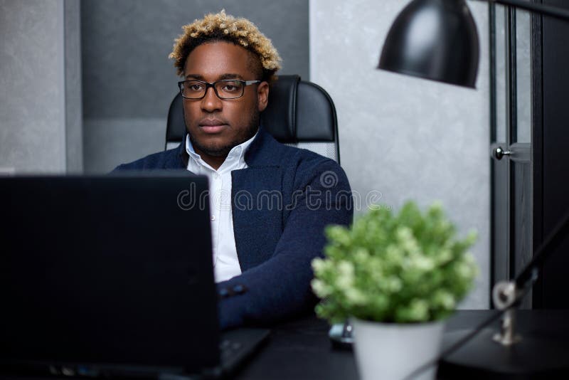 Young African Businessman with an Afro Hairstyle Working from Home ...