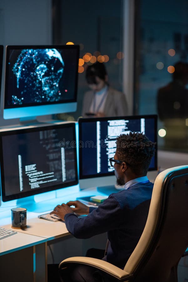 Young African Developer Sitting in Armchair by Desk Stock Photo - Image ...