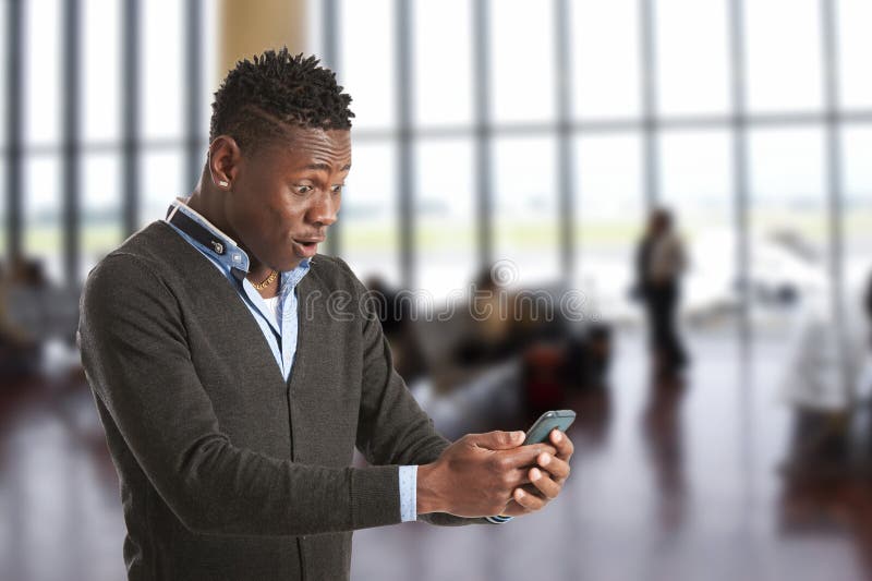 Young African Guy Looking at Cell Phone Stock Photo - Image of afro ...