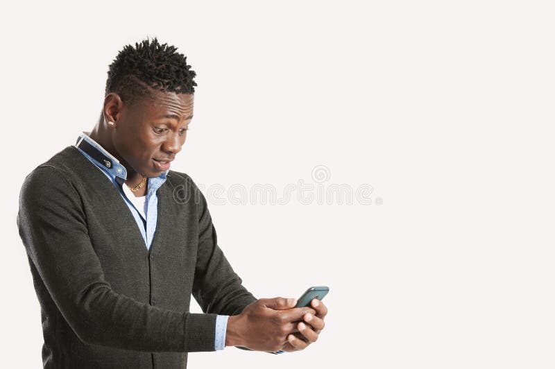 Young African Guy Looking at Cell Phone Stock Image - Image of hand ...