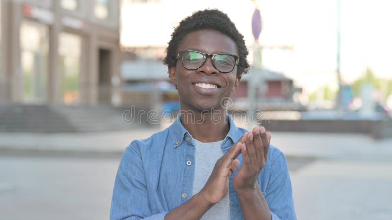 Young African Man Clapping in Appreciation Outdoor Stock Photo - Image ...