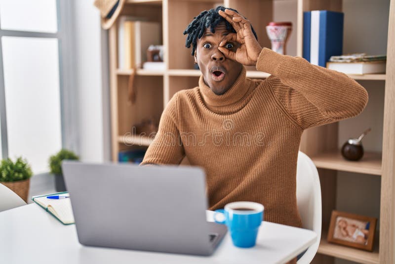 Young African Man with Dreadlocks Working Using Computer Laptop Doing ...