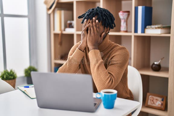 Young African Man with Dreadlocks Working Using Computer Laptop with ...