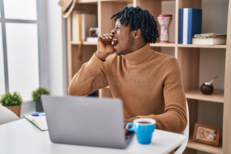 Young African Man with Dreadlocks Working Using Computer Laptop ...