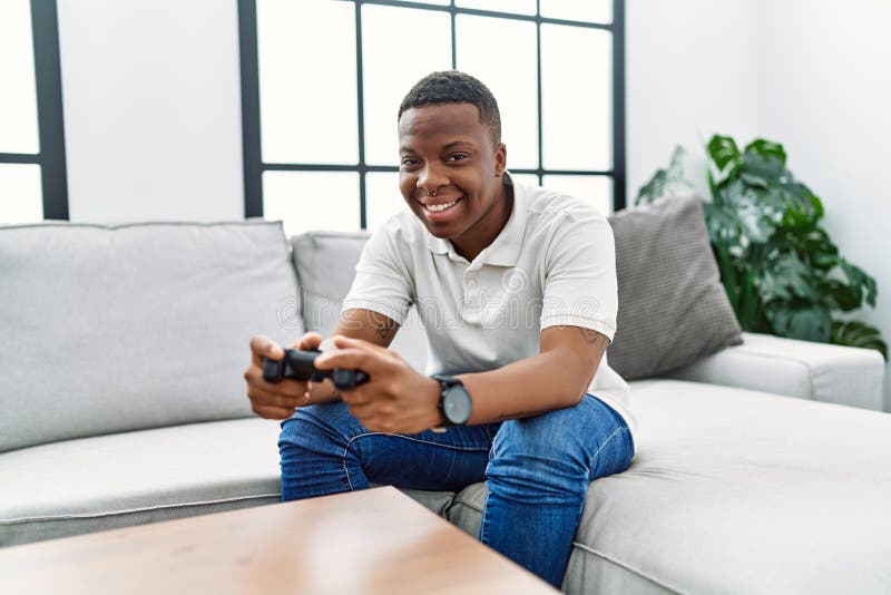 Young African Man Playing Video Games at Home Stock Image - Image of ...