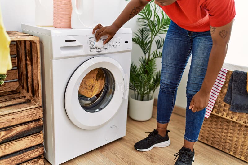 Young African Man Setting Washing Machine at Laundry Room Stock Photo ...