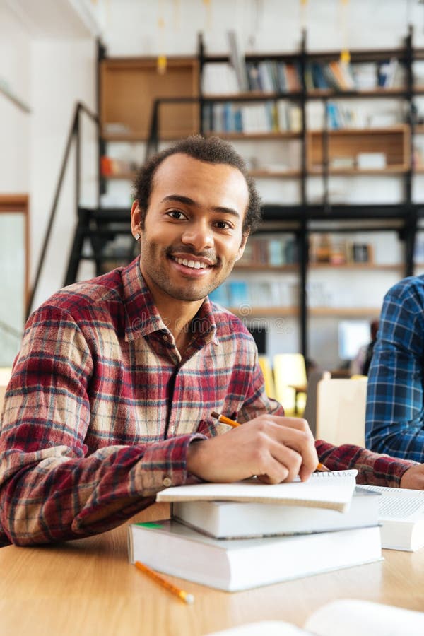 Young African Man Student Sitting in Library Stock Image - Image of ...