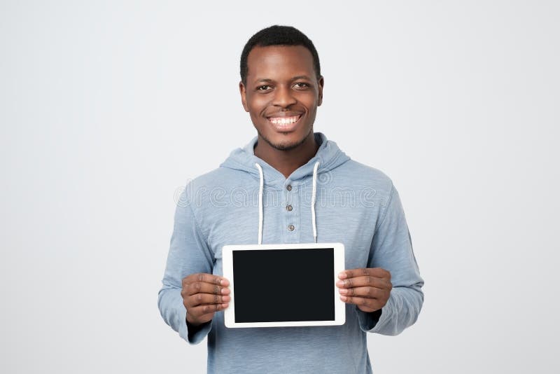 Young African Man with Tablet Showing Screen of Modern Tablet. Stock ...