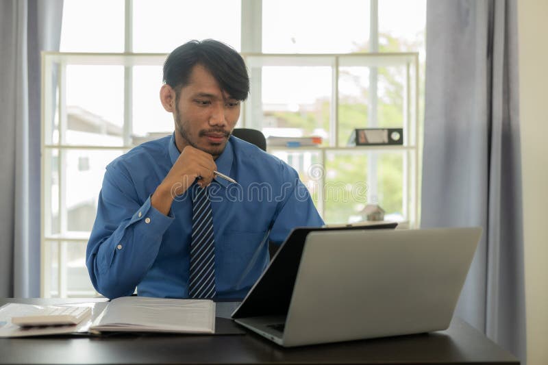 Young African Man Working with Analytics Sitting in Beautiful Workplace ...