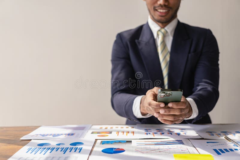 Young African Man Working with Analytics Sitting in Beautiful Workplace ...