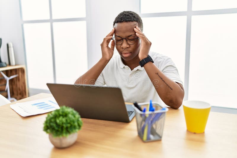 Young African Man Working at the Office Using Computer Laptop with Hand ...