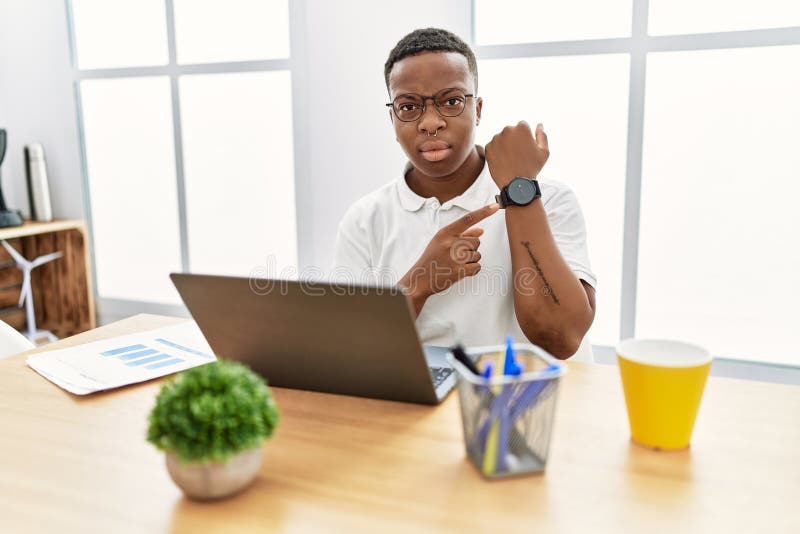 Young African Man Working at the Office Using Computer Laptop in Hurry ...