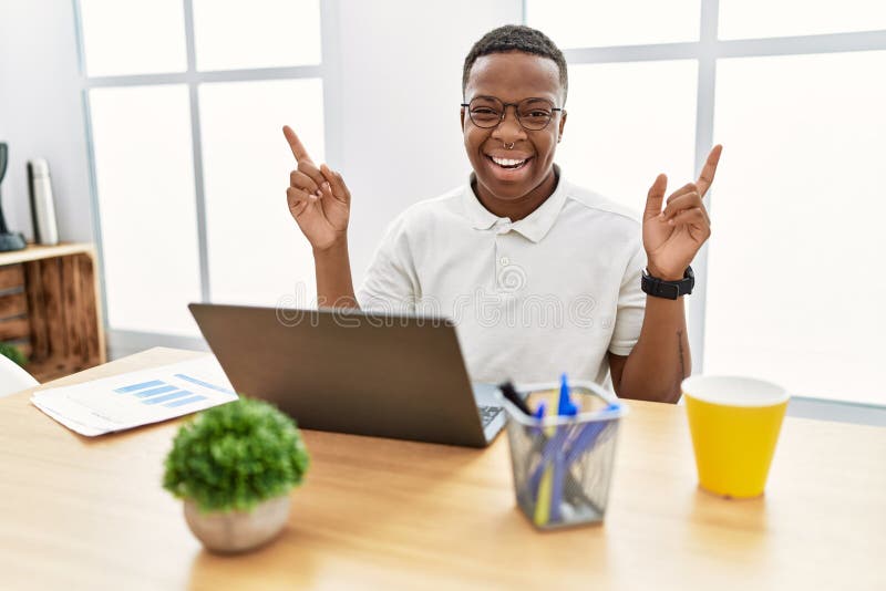 Young African Man Working at the Office Using Computer Laptop Smiling ...