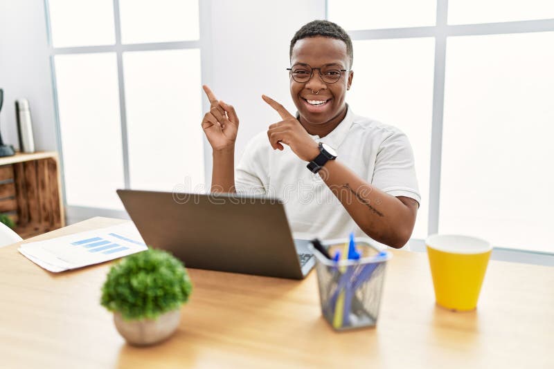 Young African Man Working at the Office Using Computer Laptop Smiling ...