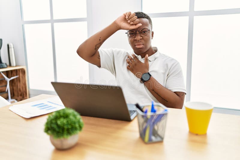 Young African Man Working at the Office Using Computer Laptop Touching ...