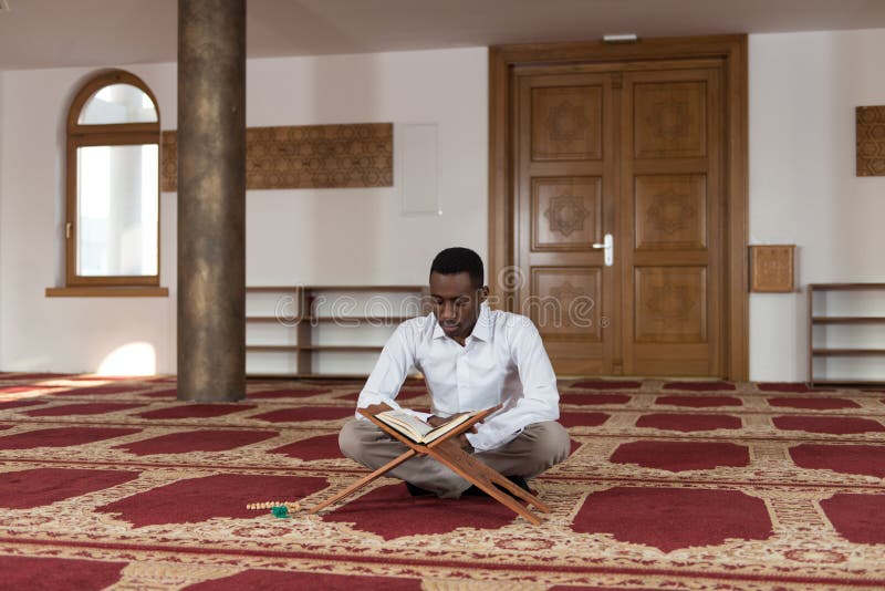 Young African Muslim Guy Reading the Koran Stock Image - Image of adult ...
