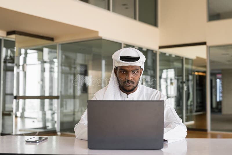 Young African Muslim Man Using Laptop Computer at Office Stock Photo ...