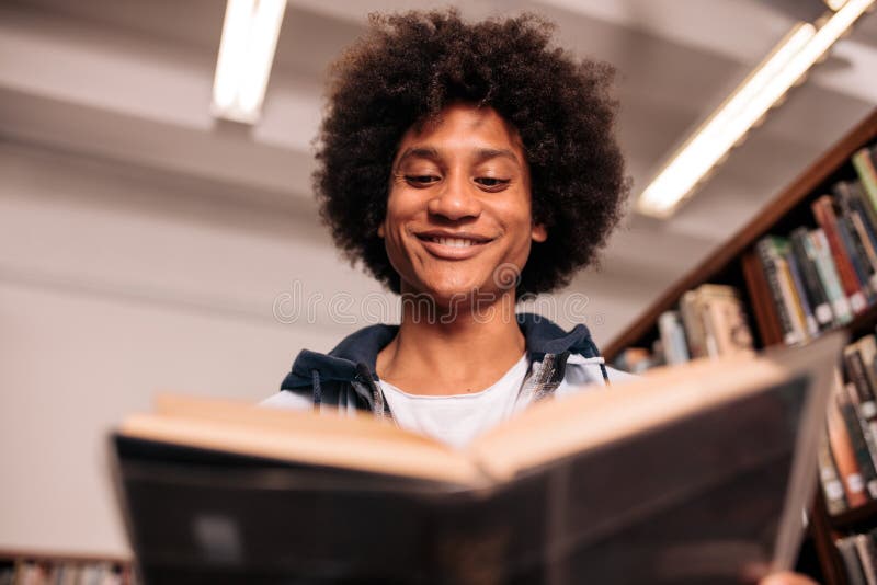 Young African Student Studying in Library Stock Photo - Image of person ...