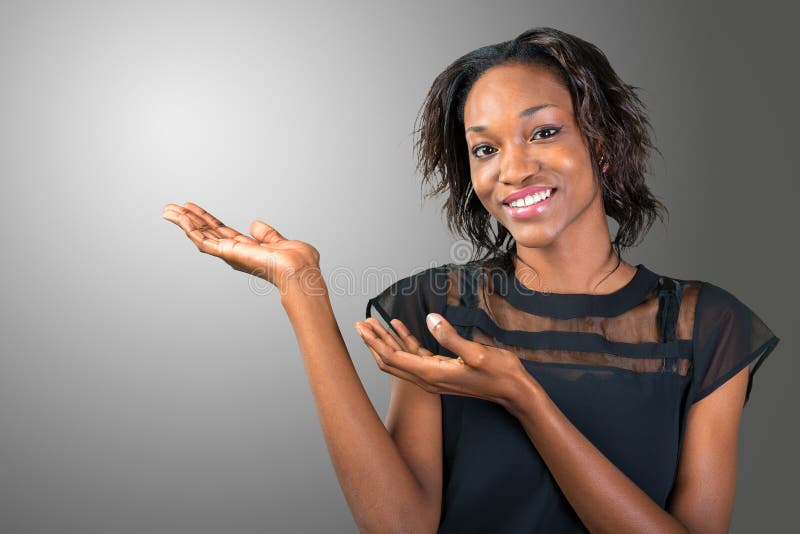Young African Woman Presenting Stock Photo - Image of introducing ...
