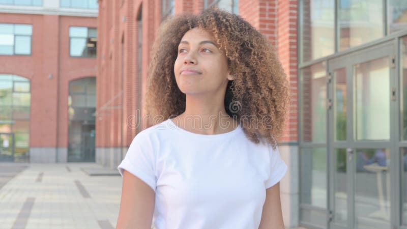 Close Up of Young African Woman Strolling in Street, Front Pose Stock ...