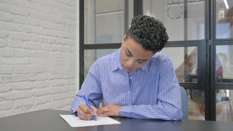 The Young African Woman Writing a Letter in Office Stock Video - Video ...