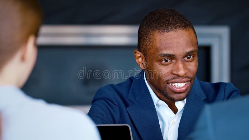 Young Afro American Man in a Suit Talking with Colleagues in Coworking ...