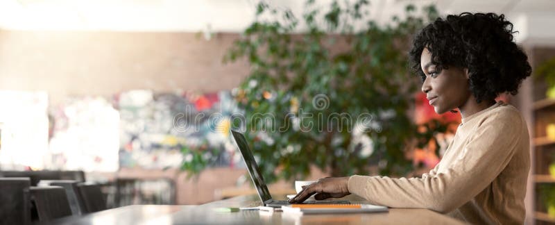 Young Afro Woman Working in Cafe, Using Laptop Stock Photo - Image of ...