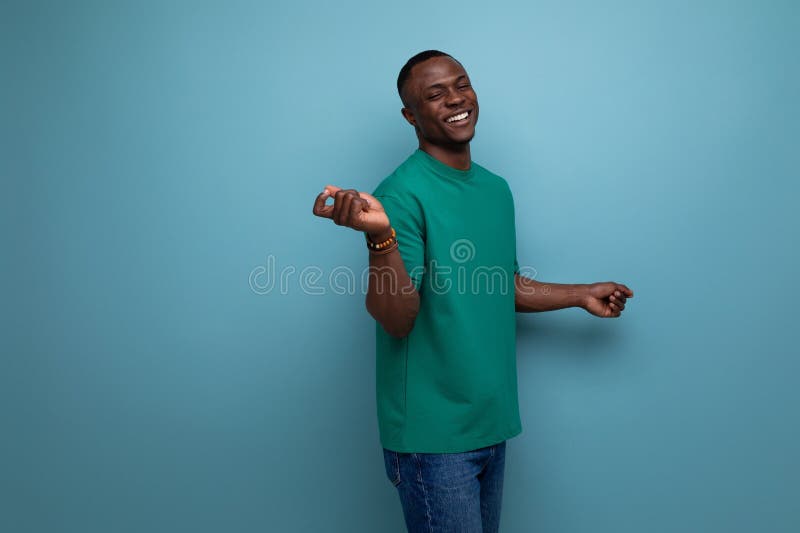 Young American Guy Dressed in a Basic T-shirt with His Hands Raised for ...