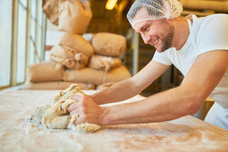 Young Apprentice Baker Kneading Dough with Flour Stock Image - Image of ...