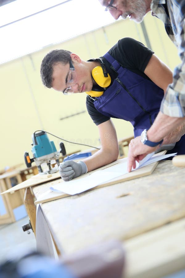 Young Apprentice in Carpentry Course Stock Photo - Image of trainer ...