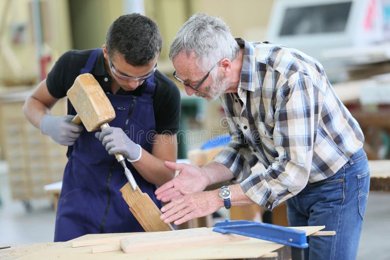 Young Apprentice in Carpentry with Instructor Stock Photo - Image of ...