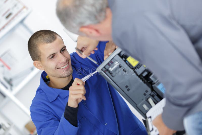 Young Apprentice Engineer Learning To Fix Computer Stock Photo - Image ...