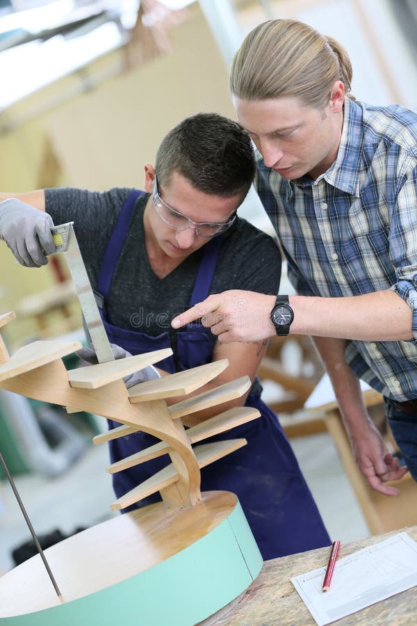 Young Apprentice with Instructor Working on Wood Stock Image - Image of ...
