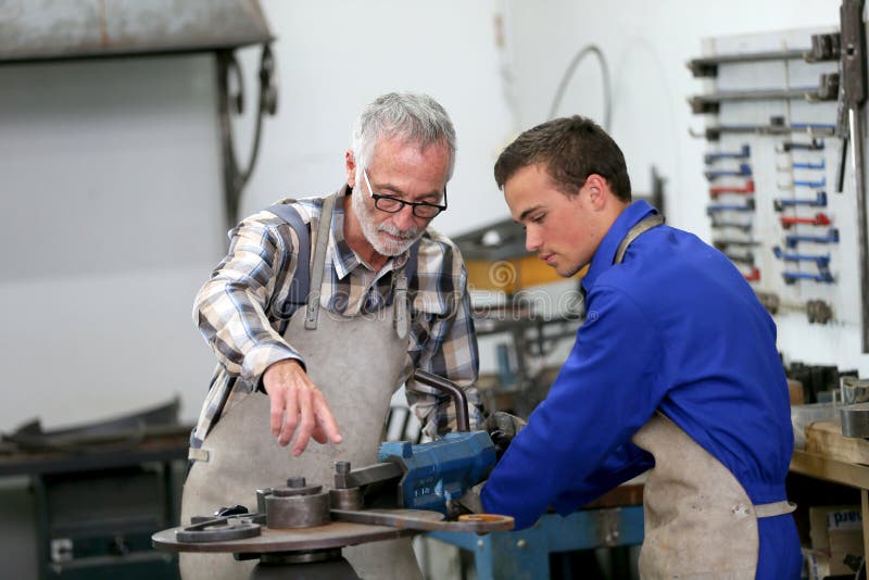 Young Apprentice in Ironworks with Monitor Stock Photo - Image of steel ...