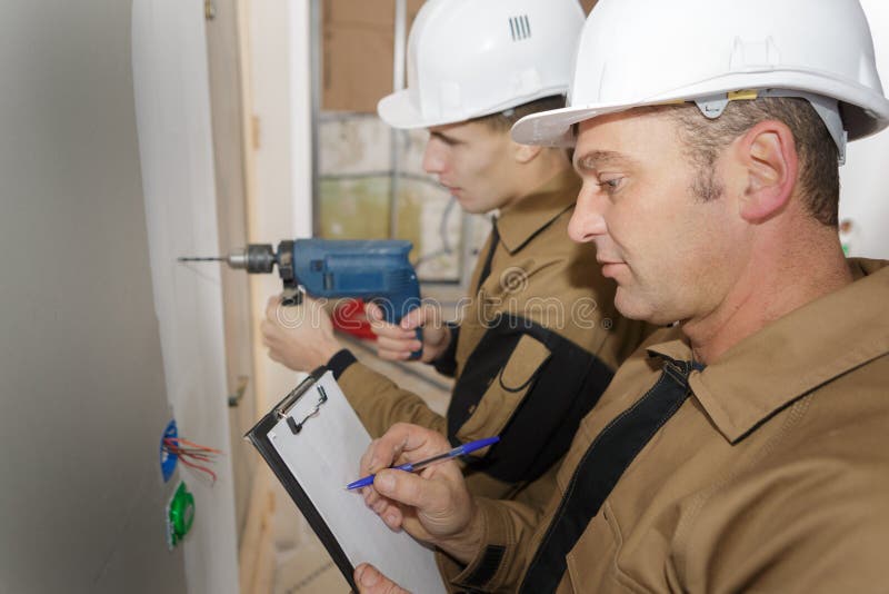 Young Apprentice Learning To Drill Stock Image - Image of tool, smiling ...