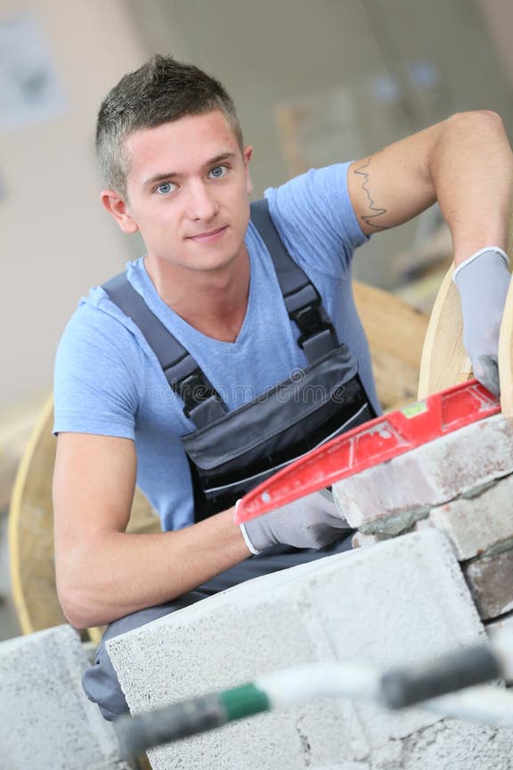 Young Apprentice in Masonery Stock Photo - Image of bricks, layer: 55516902