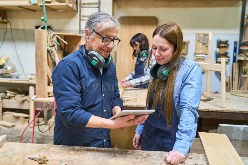 Young Apprentice and Mentor Collaborating in a Busy Lumberyard Workshop Stock Image - Image of ...