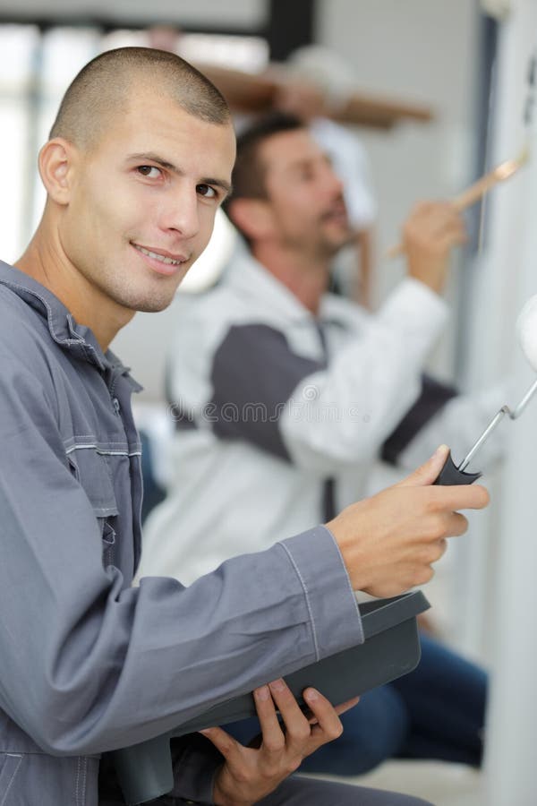 Young Apprentice Painter in Professional Training Stock Image - Image ...