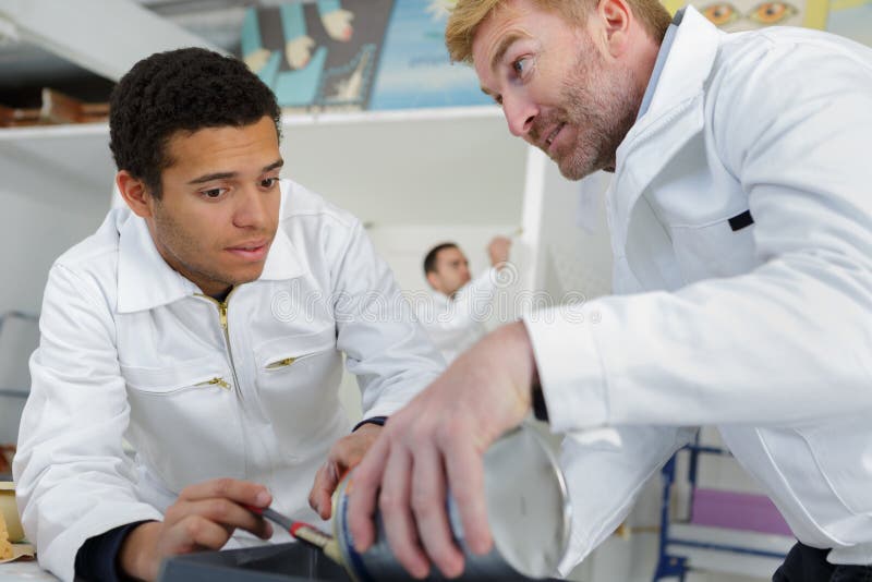 Young Apprentice Painter in Professional Training Stock Image - Image ...
