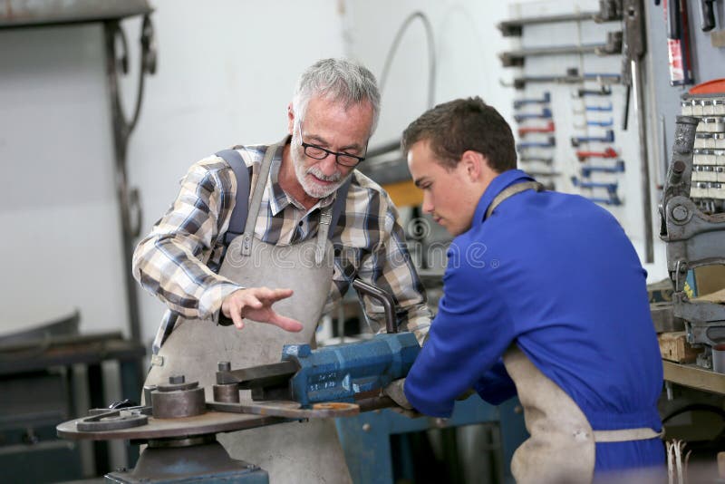 Young Apprentice in Professional Training in Ironworks Stock Photo ...