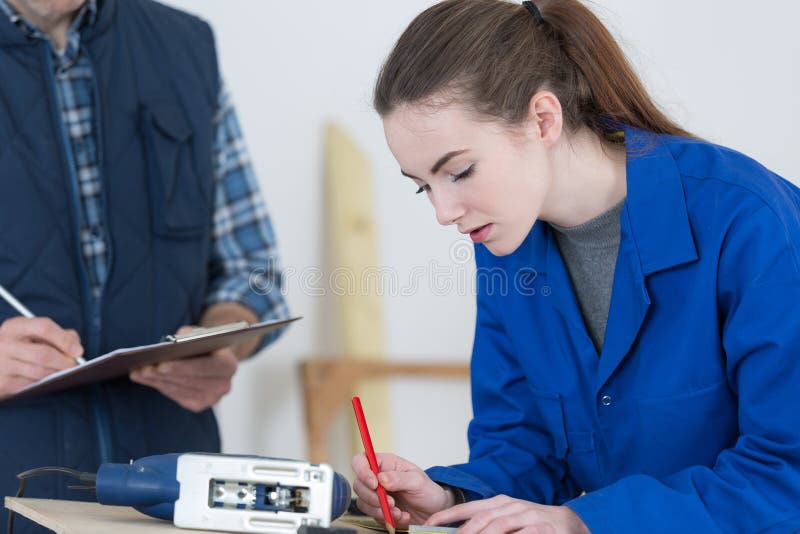 Young Apprentice Woman Working in Workshop Stock Photo - Image of ...
