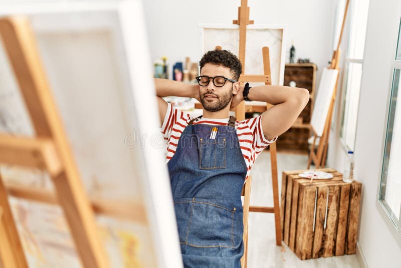 Young Arab Artist Man Relaxed with Hands on Head at Art Studio Stock ...