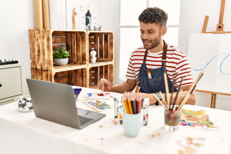 Young Arab Artist Man Using Laptop Drawing at Art Studio Stock Image ...