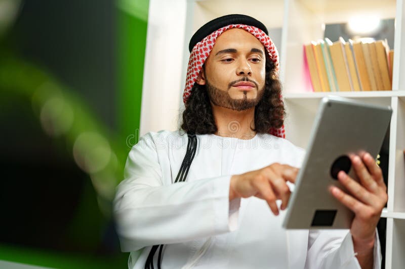 Young Arab Businessman Using Digital Tablet in an Office Stock Image ...
